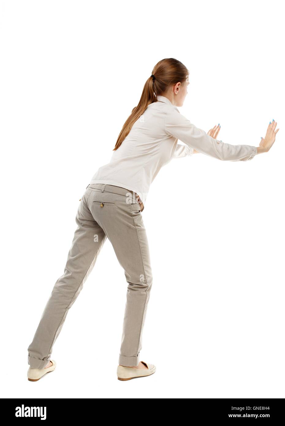 back view of woman pushes wall Stock Photo - Alamy
