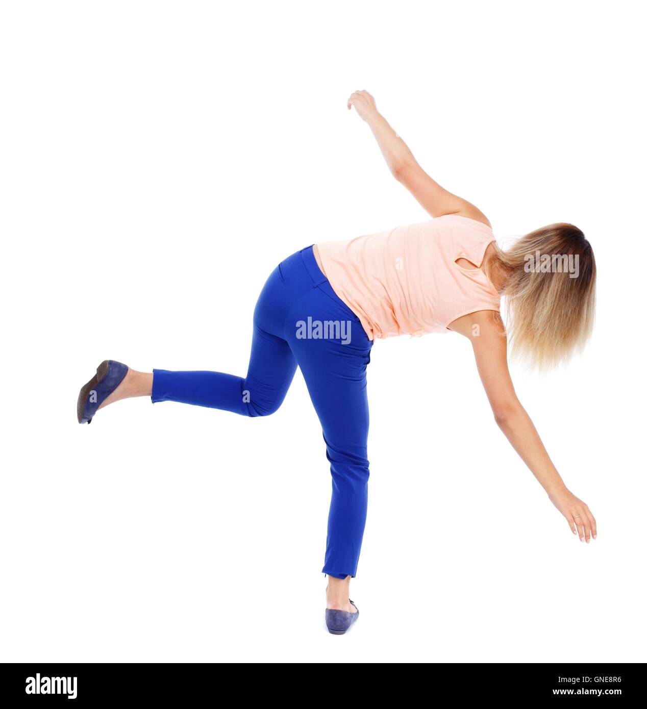 Balancing young woman Stock Photo - Alamy