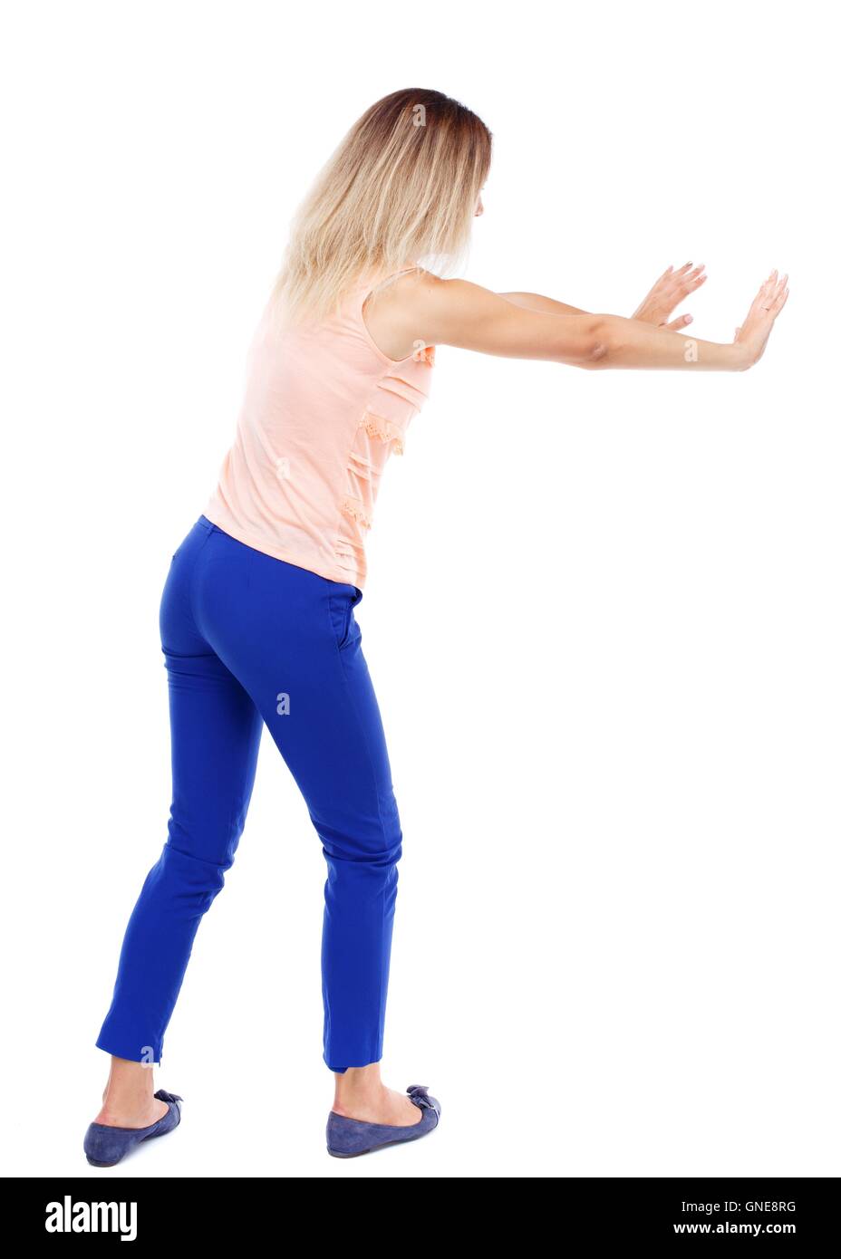back view of woman pushes wall Stock Photo - Alamy