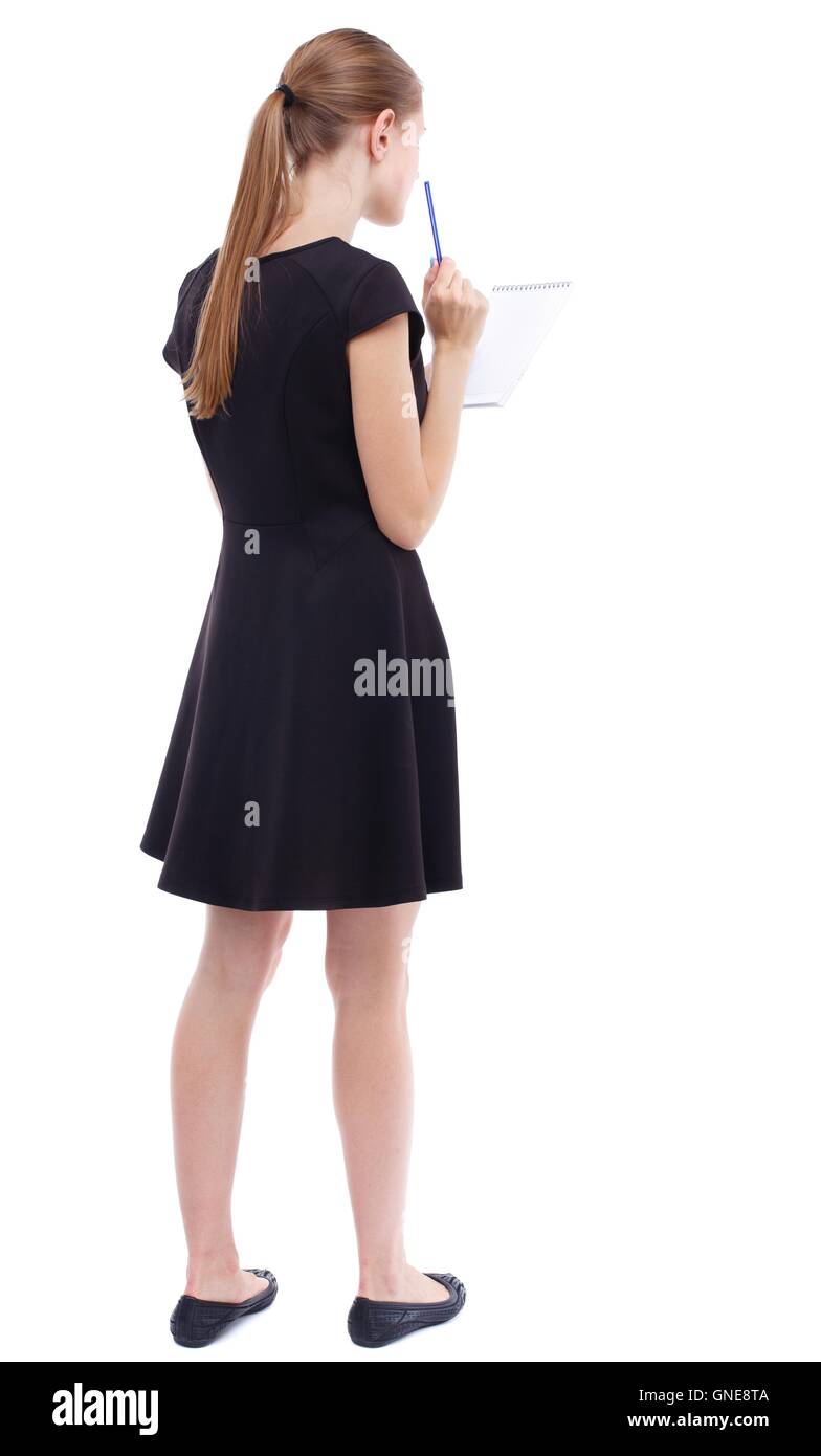 back view of stands woman takes notes in a notebook Stock Photo - Alamy
