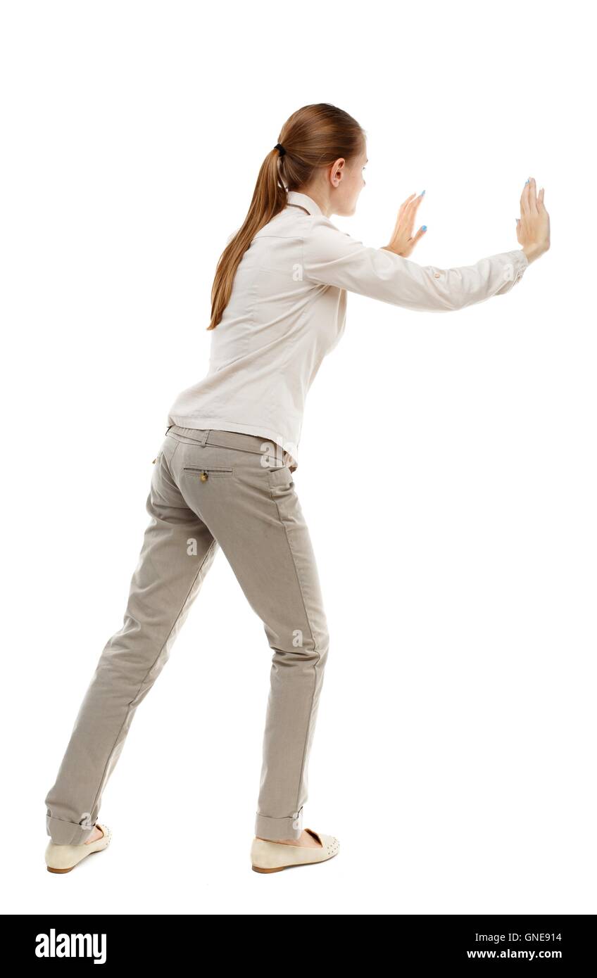 back view of woman pushes wall Stock Photo - Alamy