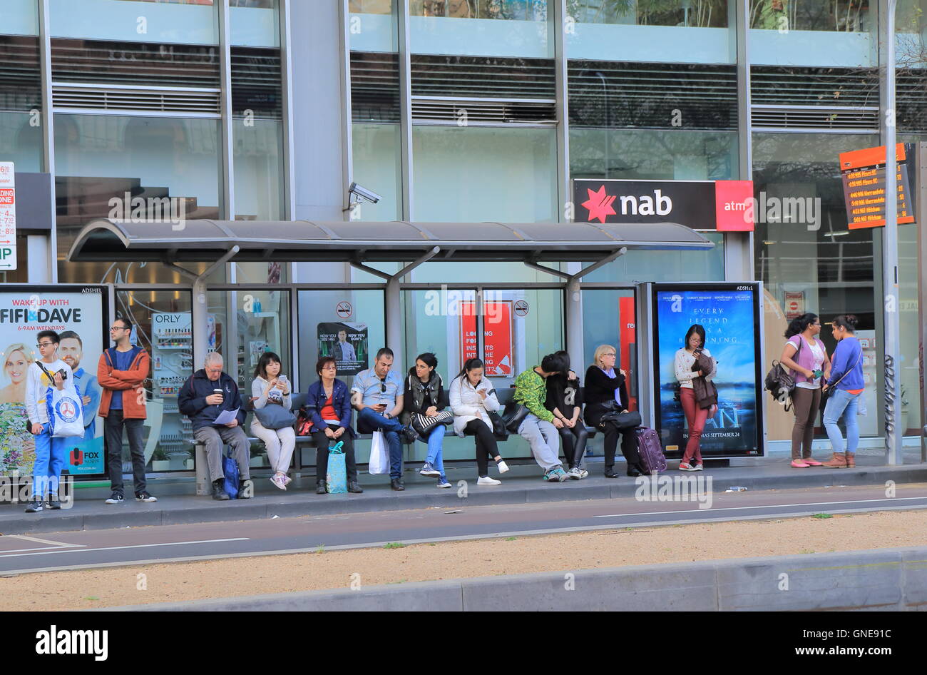 People wait at bus stop in Melbourne city centre. Australia Stock Photo ...