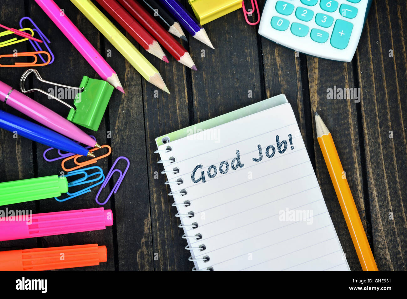 Good Job text on notepad and office tools on wooden table Stock Photo ...