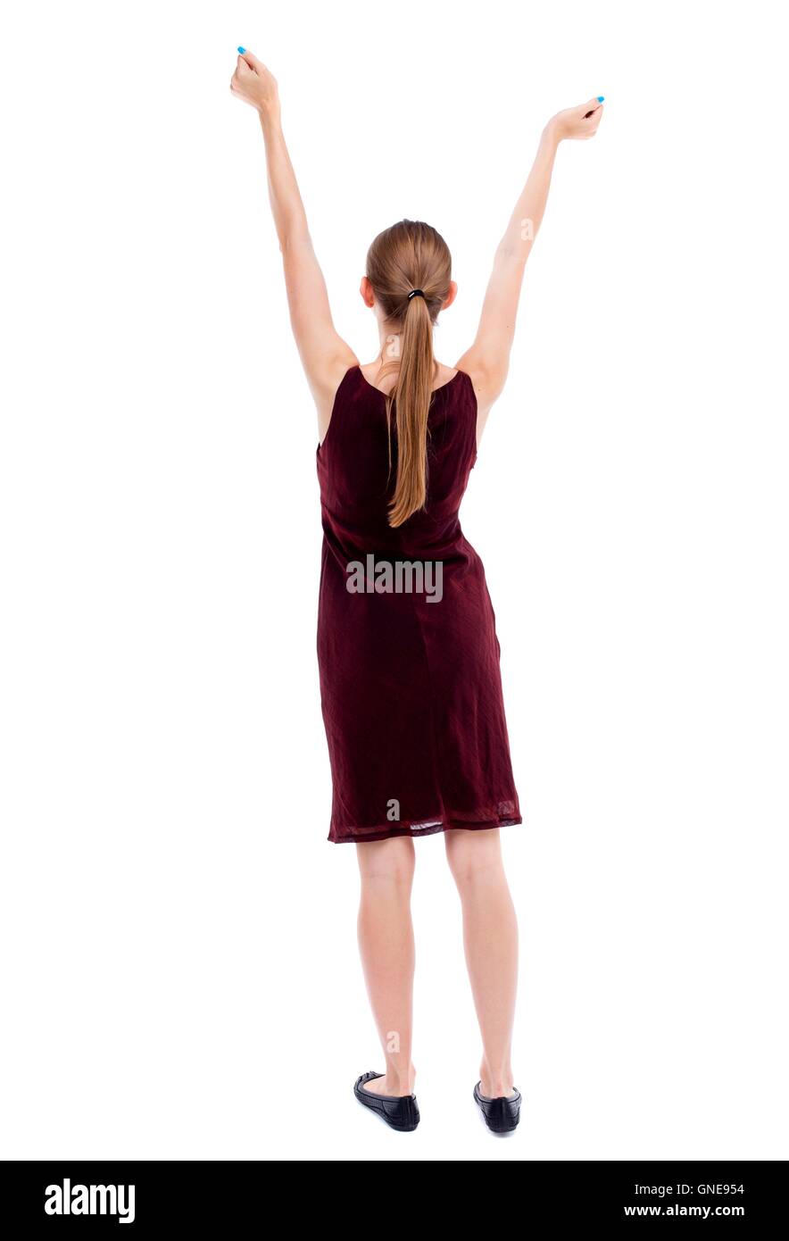 Back view of woman. Raised his fist up in victory sign Stock Photo - Alamy