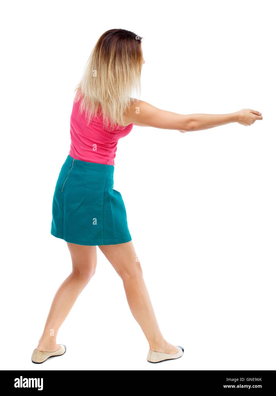 back view of standing girl pulling a rope from the top or cling Stock ...