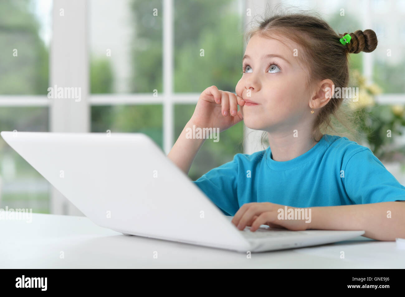 Little girl using computer Stock Photo - Alamy