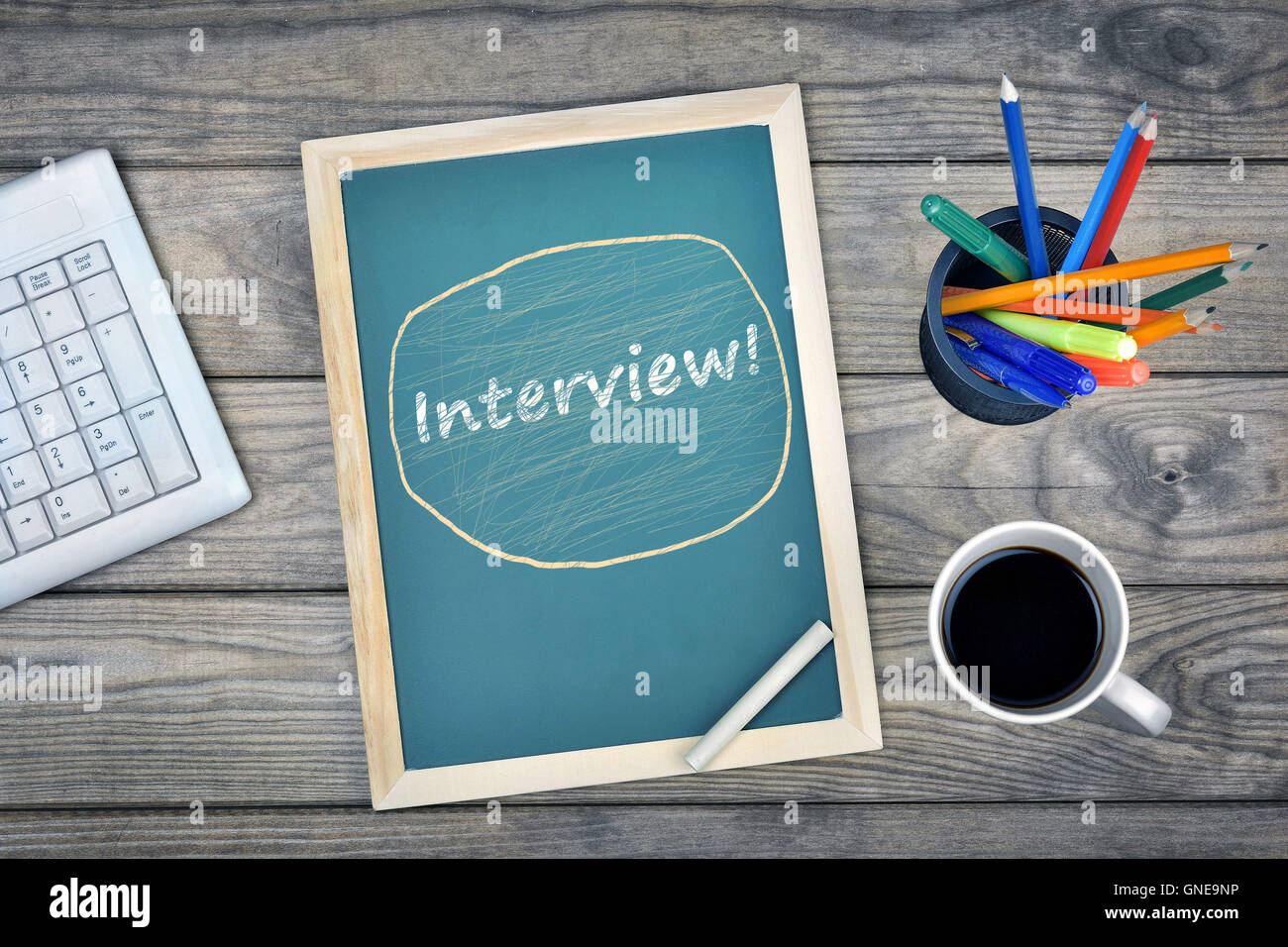 Interview text on school board and coffee on desk Stock Photo - Alamy