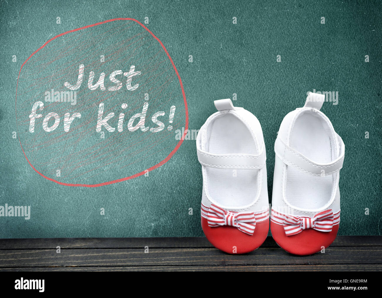 Just for kids text on school table and kid shoes Stock Photo - Alamy
