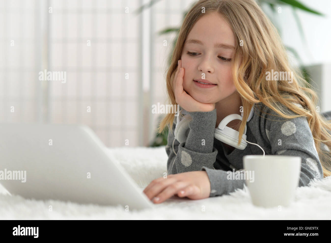 Little girl using computer Stock Photo - Alamy
