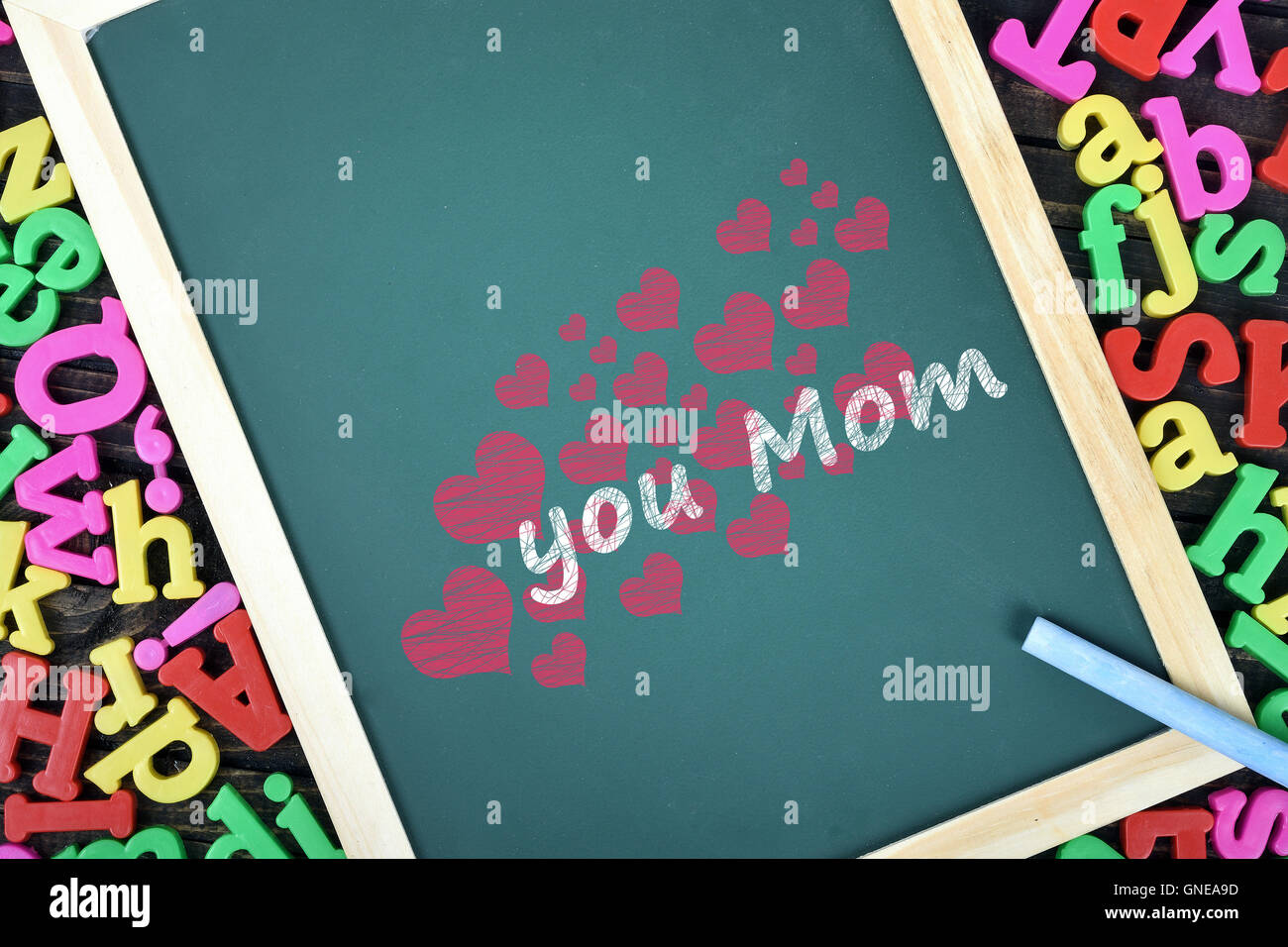 Love mom text on school board and magnetic letters Stock Photo - Alamy