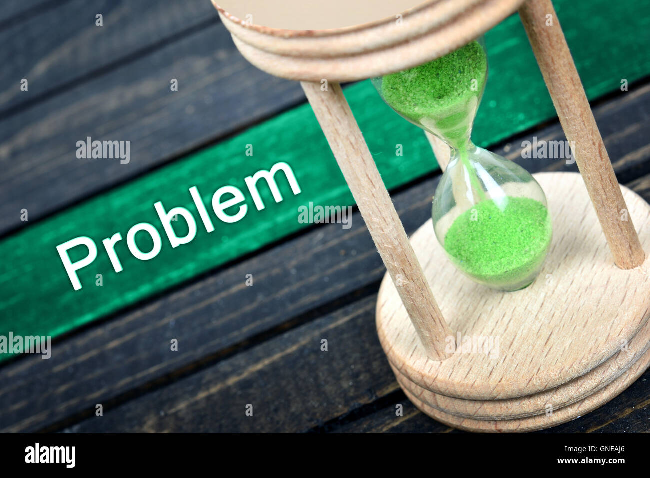 Problem text and hourglass on wooden table Stock Photo - Alamy