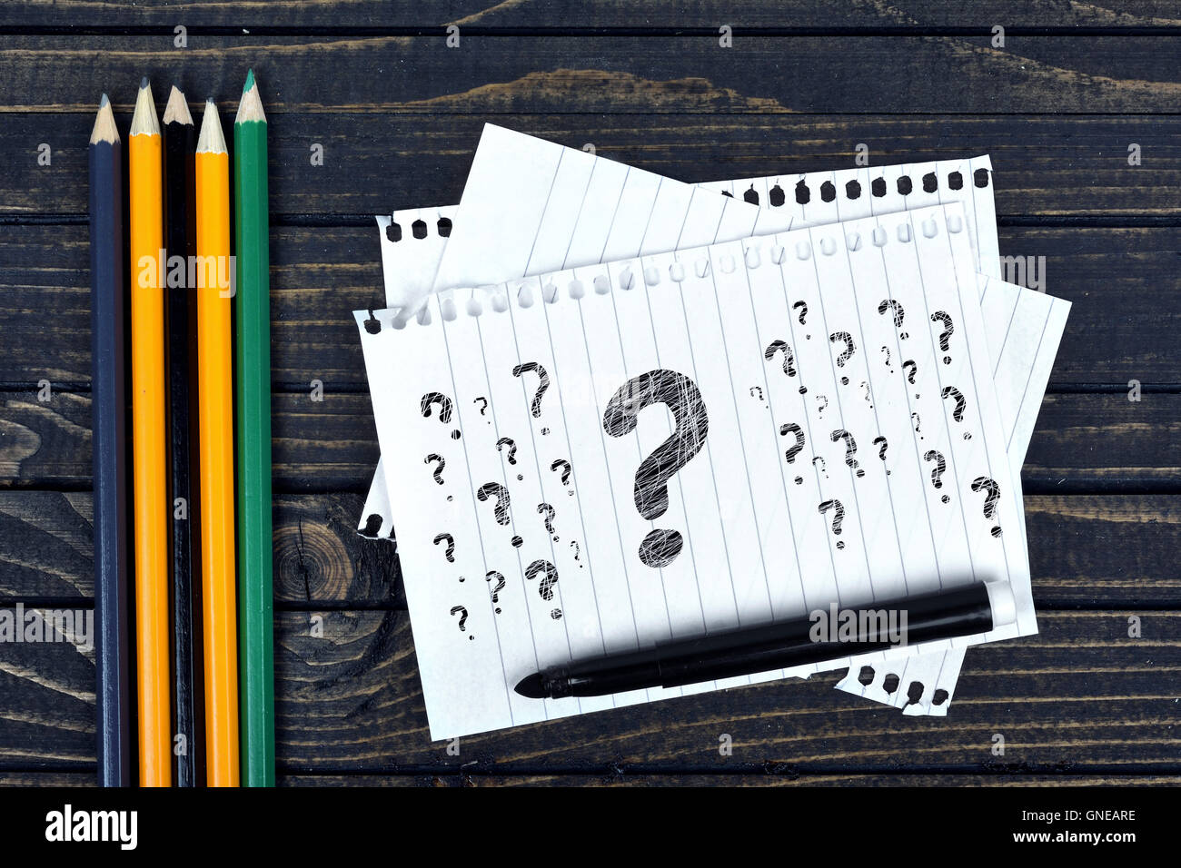 Questions text on notepad and office tools on wooden table Stock Photo ...