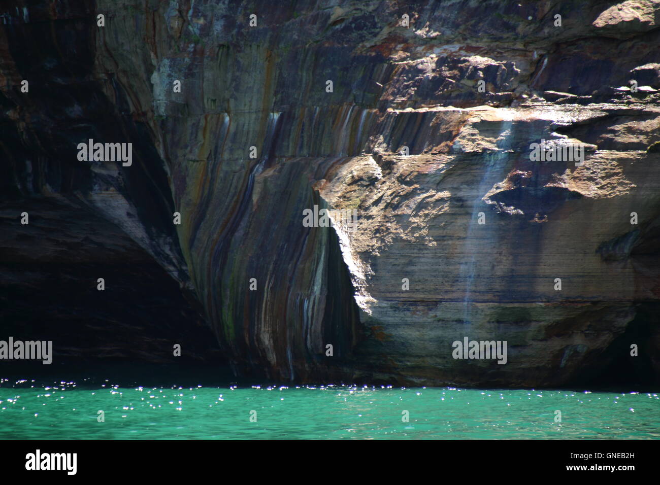 Colored stone formations on coast of Lake Superior. Pictured Rocks ...