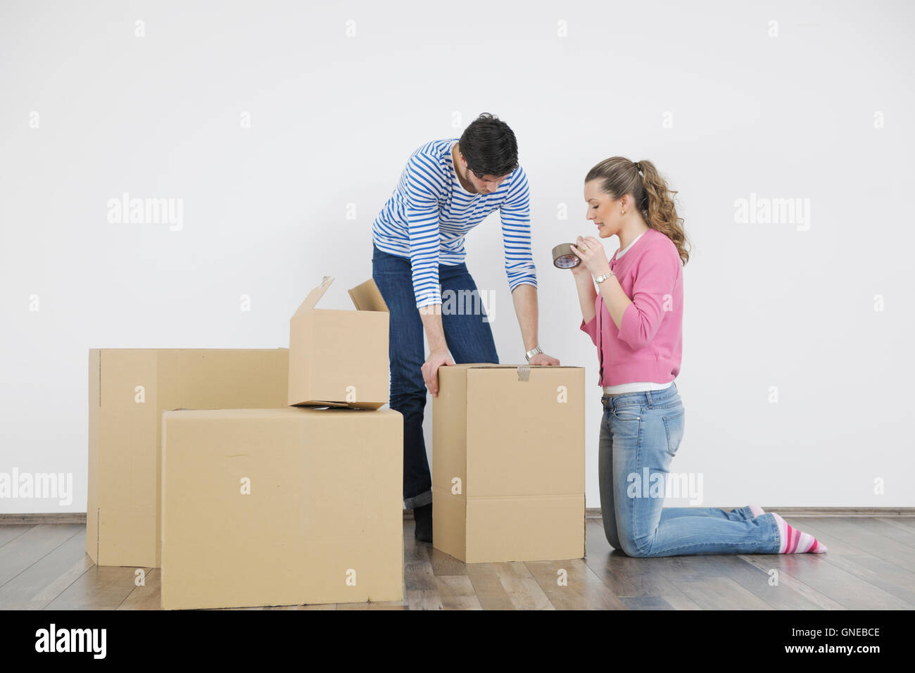 Young couple moving in new home Stock Photo - Alamy