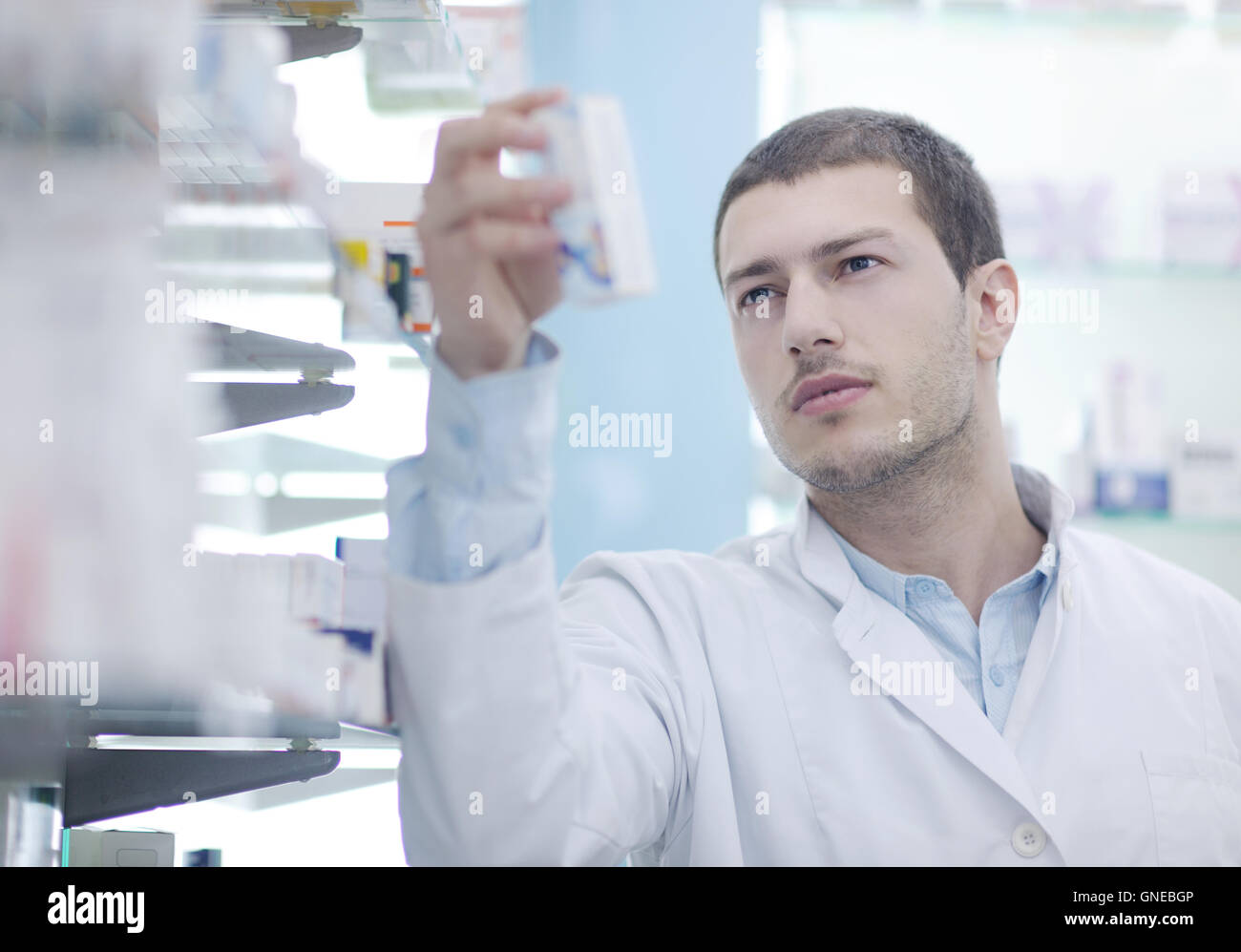 Portrait handsome young pharmacist chemist hi-res stock photography and ...