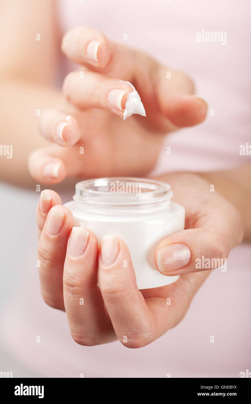 beautiful woman hands with cream Stock Photo - Alamy