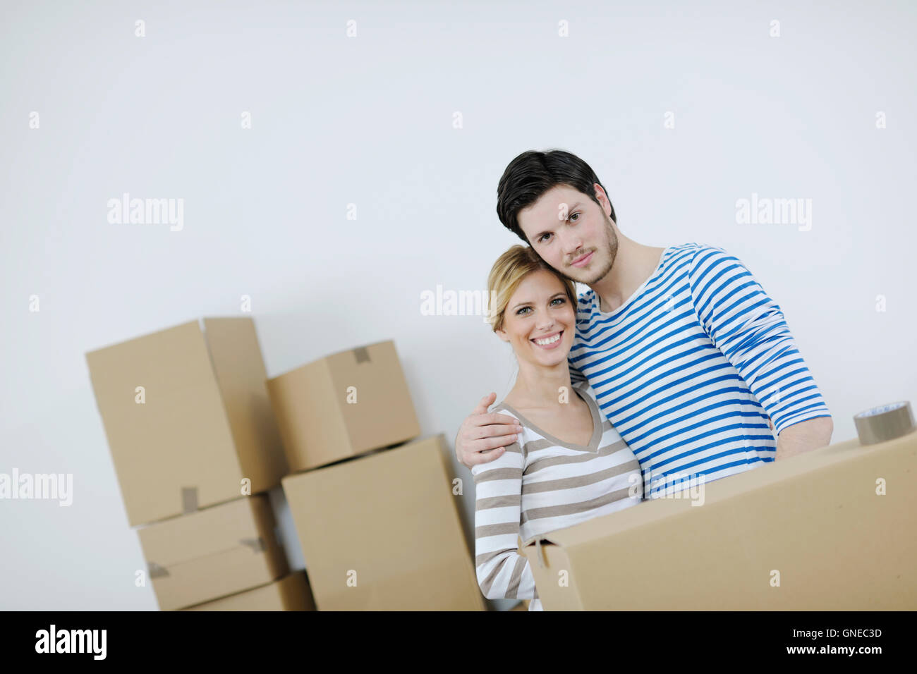 Young couple moving in new home Stock Photo - Alamy