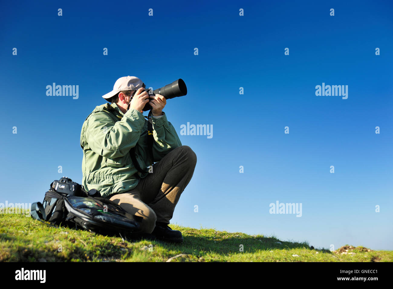 Nature photographer with digital camera Stock Photo - Alamy