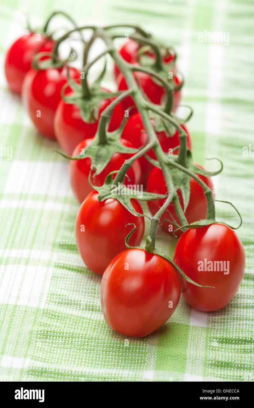 ripe tomatoes over green Stock Photo - Alamy