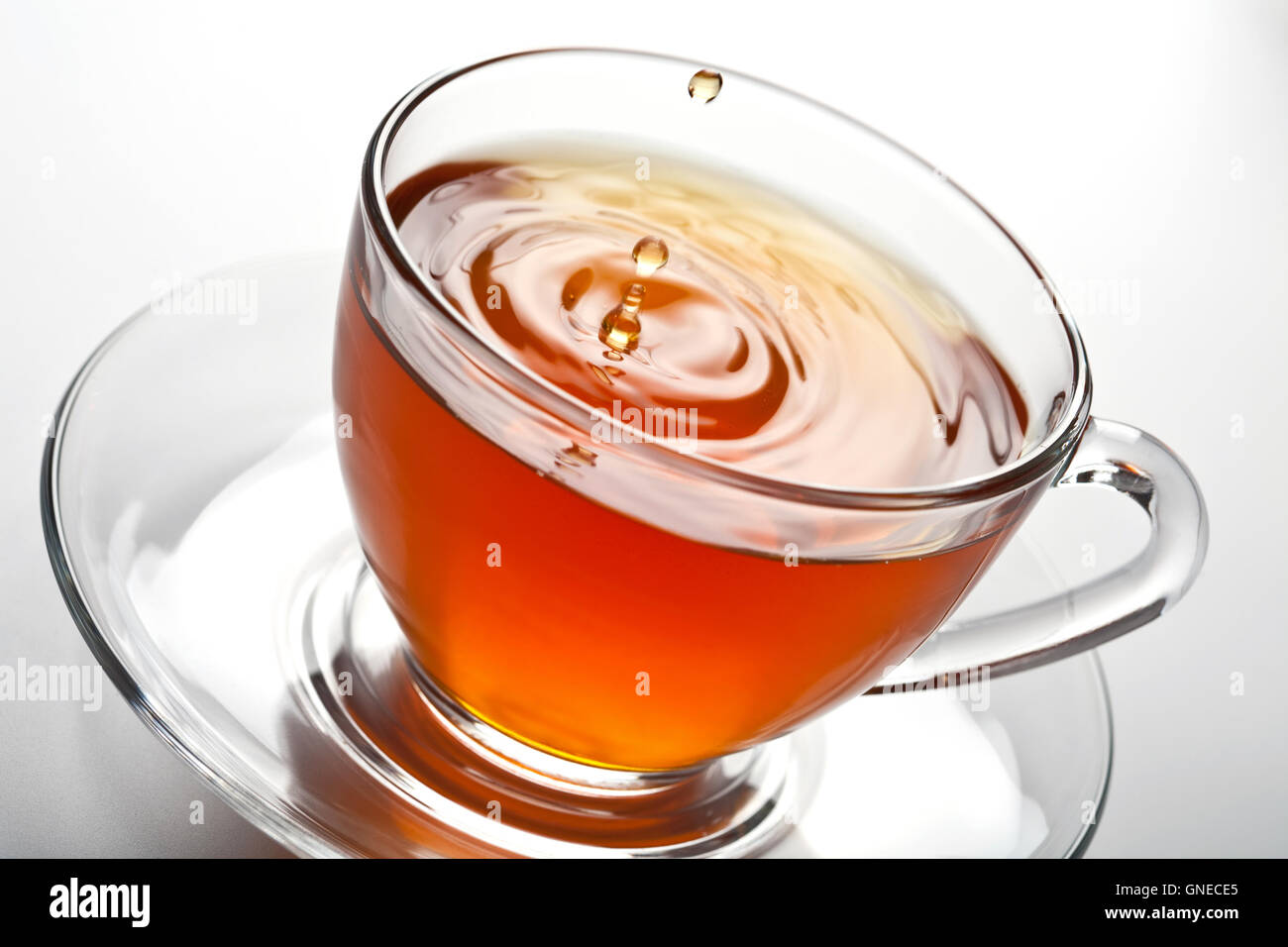 tea splash in glass cup Stock Photo - Alamy