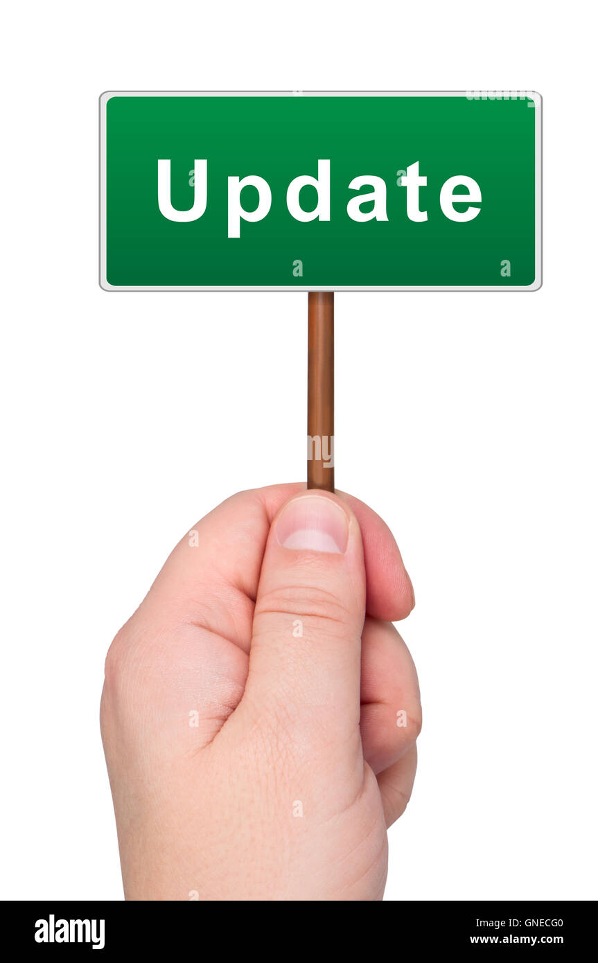 Update a road sign in hand Stock Photo - Alamy
