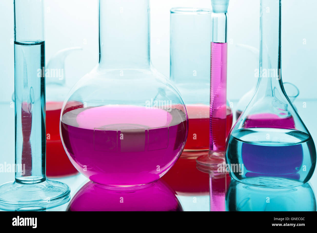 laboratory glassware with colorful chemicals Stock Photo - Alamy
