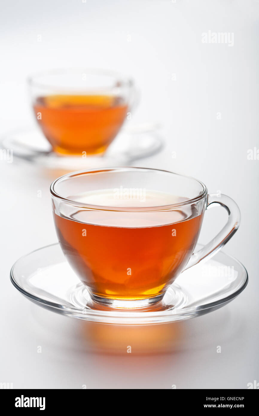 two cups of tea over white background Stock Photo - Alamy