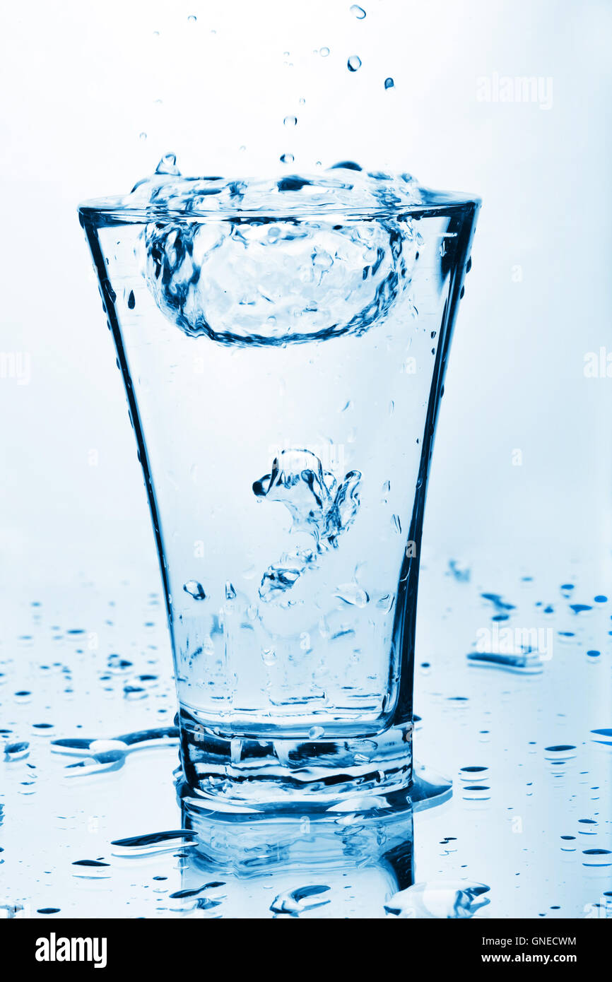 water splashing into glass Stock Photo - Alamy