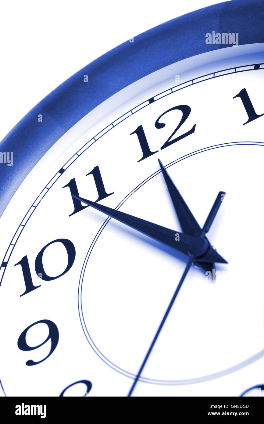 round clock showing time about twelve isolated Stock Photo - Alamy