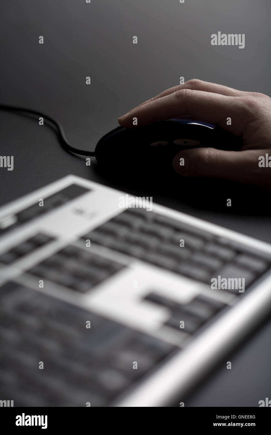 keyboard and fingers over mouse Stock Photo - Alamy