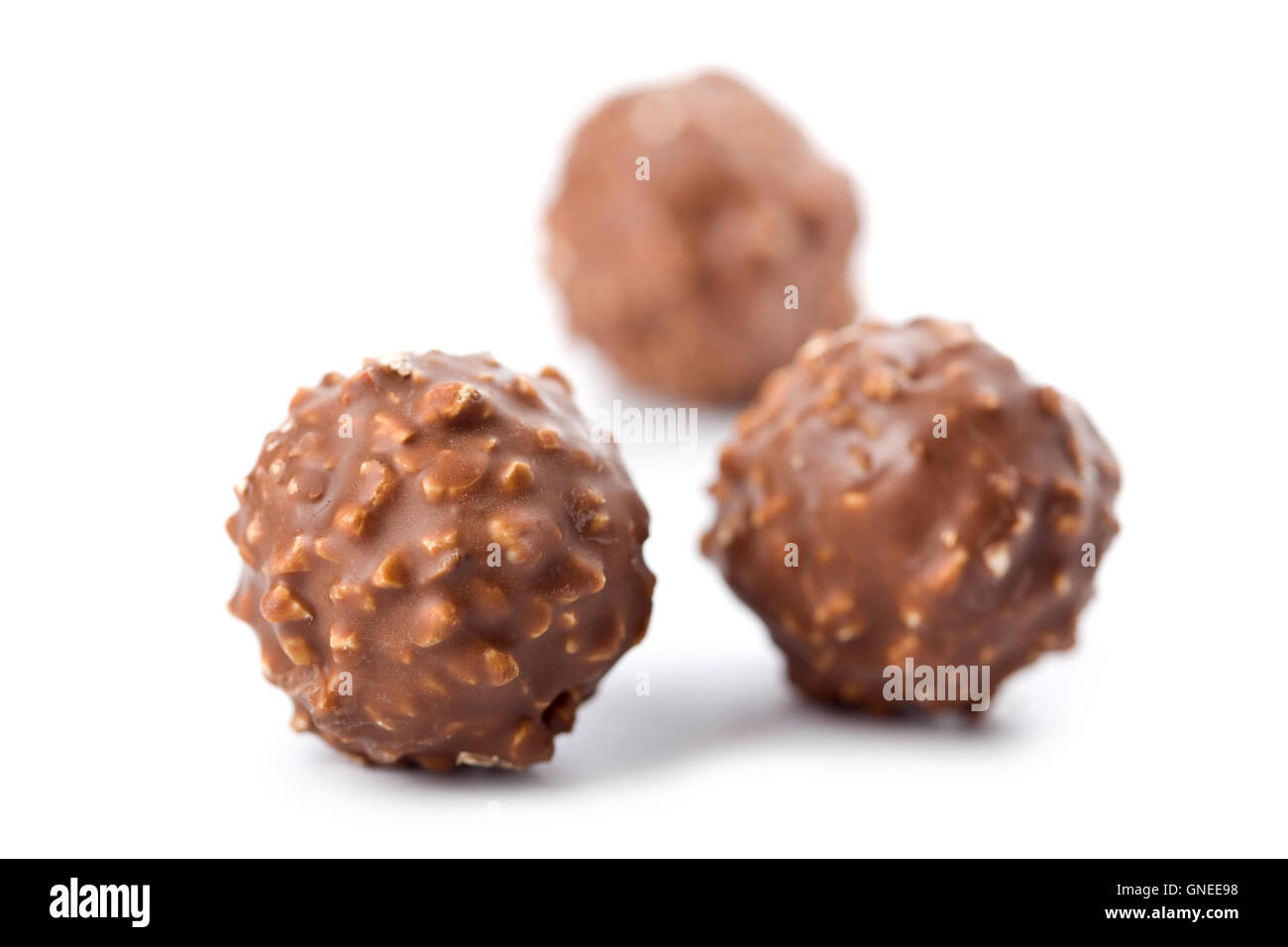 round chocolate candies isolated Stock Photo - Alamy