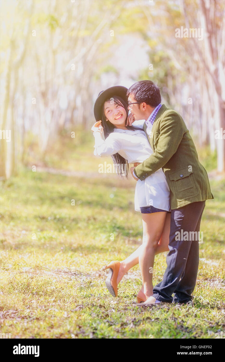 asai young romantic man and woman standing and hugging each other with ...