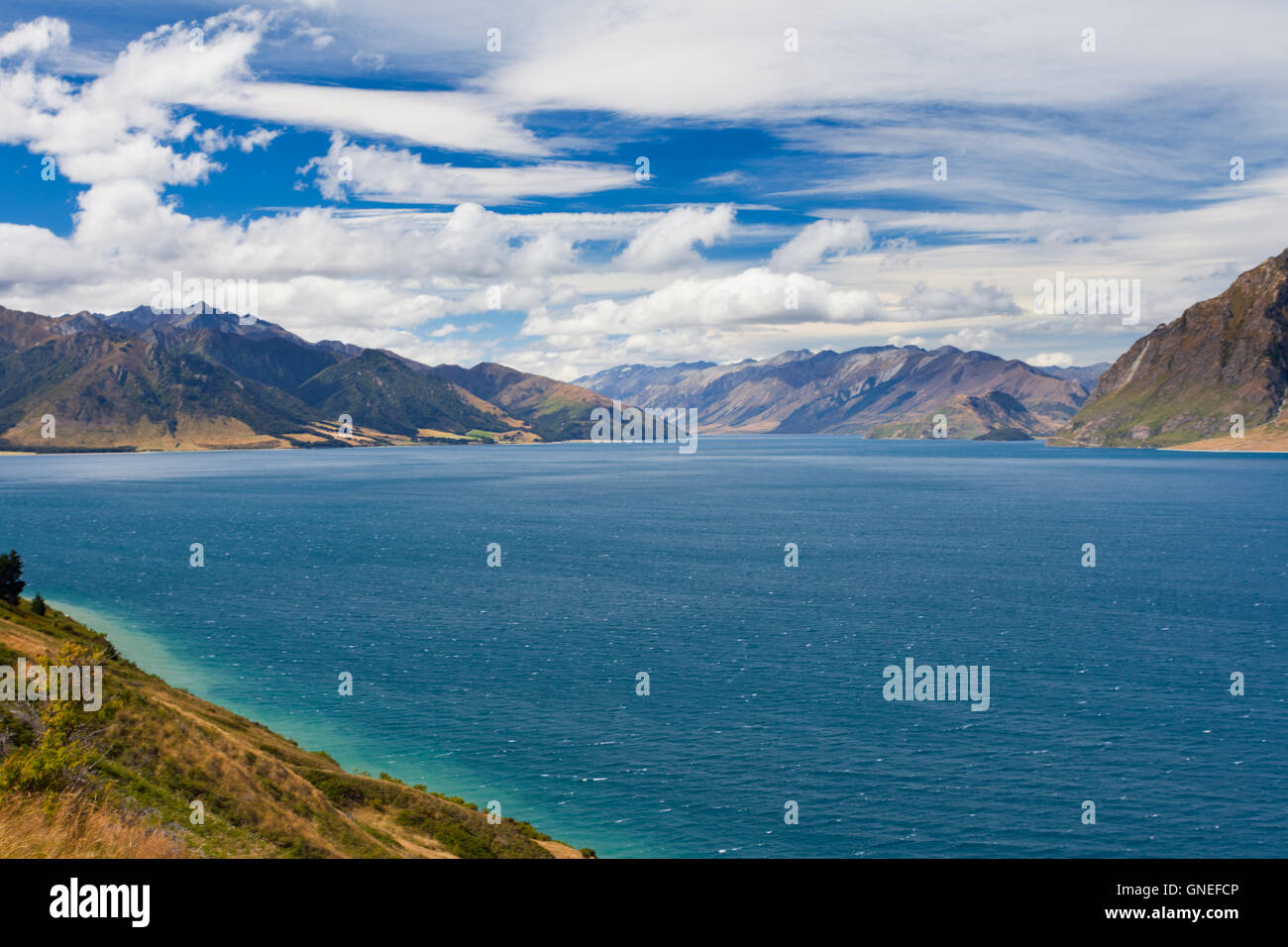 Blue surface of Lake Hawea, Central Otago, NZ Stock Photo - Alamy