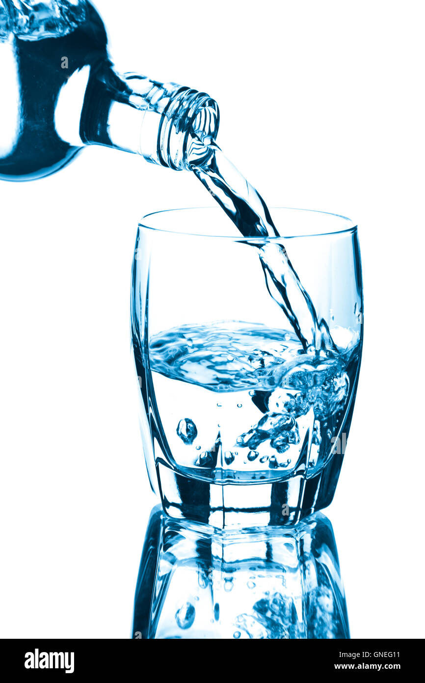 water splashing into glass isolated Stock Photo - Alamy