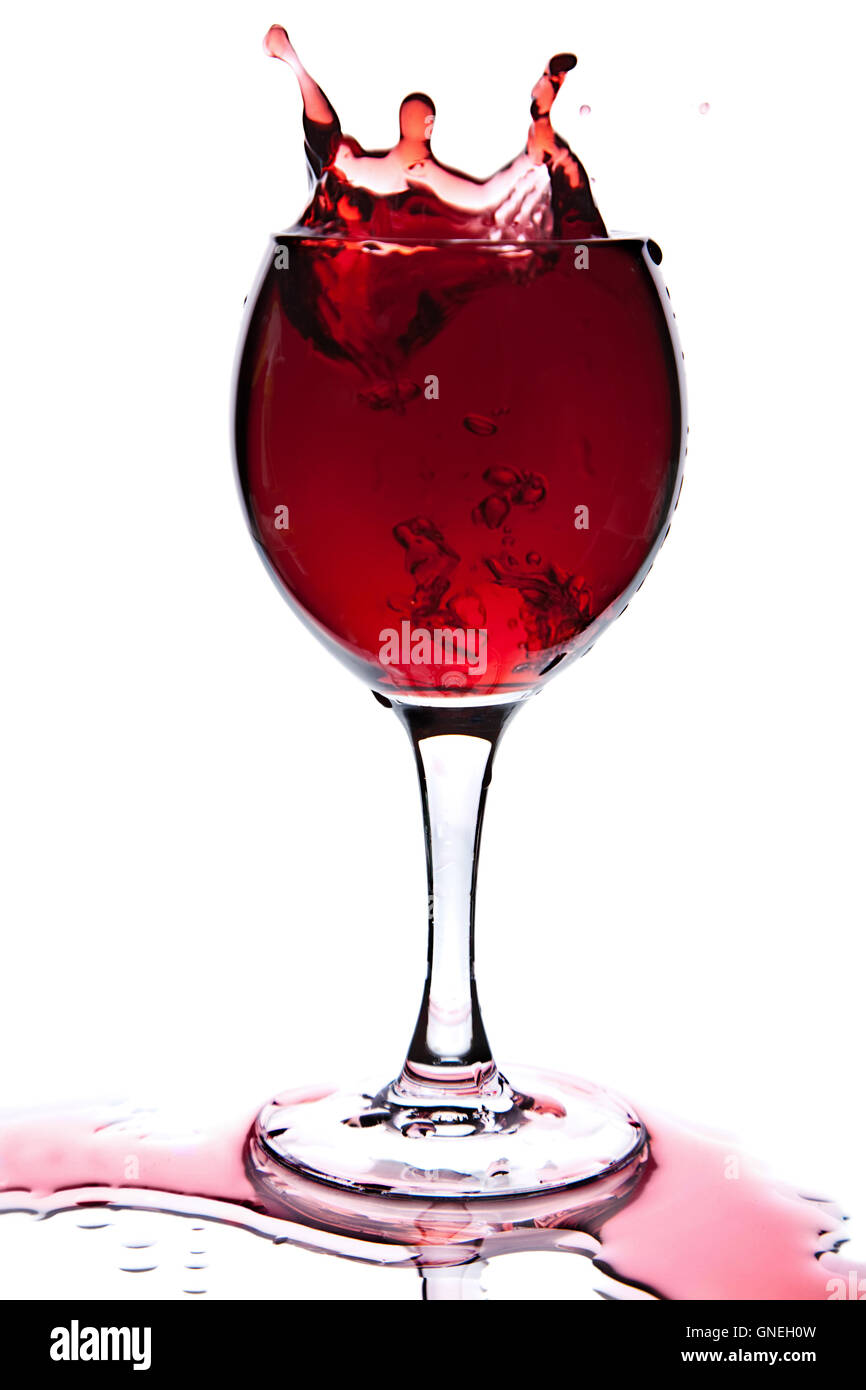 red wine splashing in glass isolated Stock Photo - Alamy