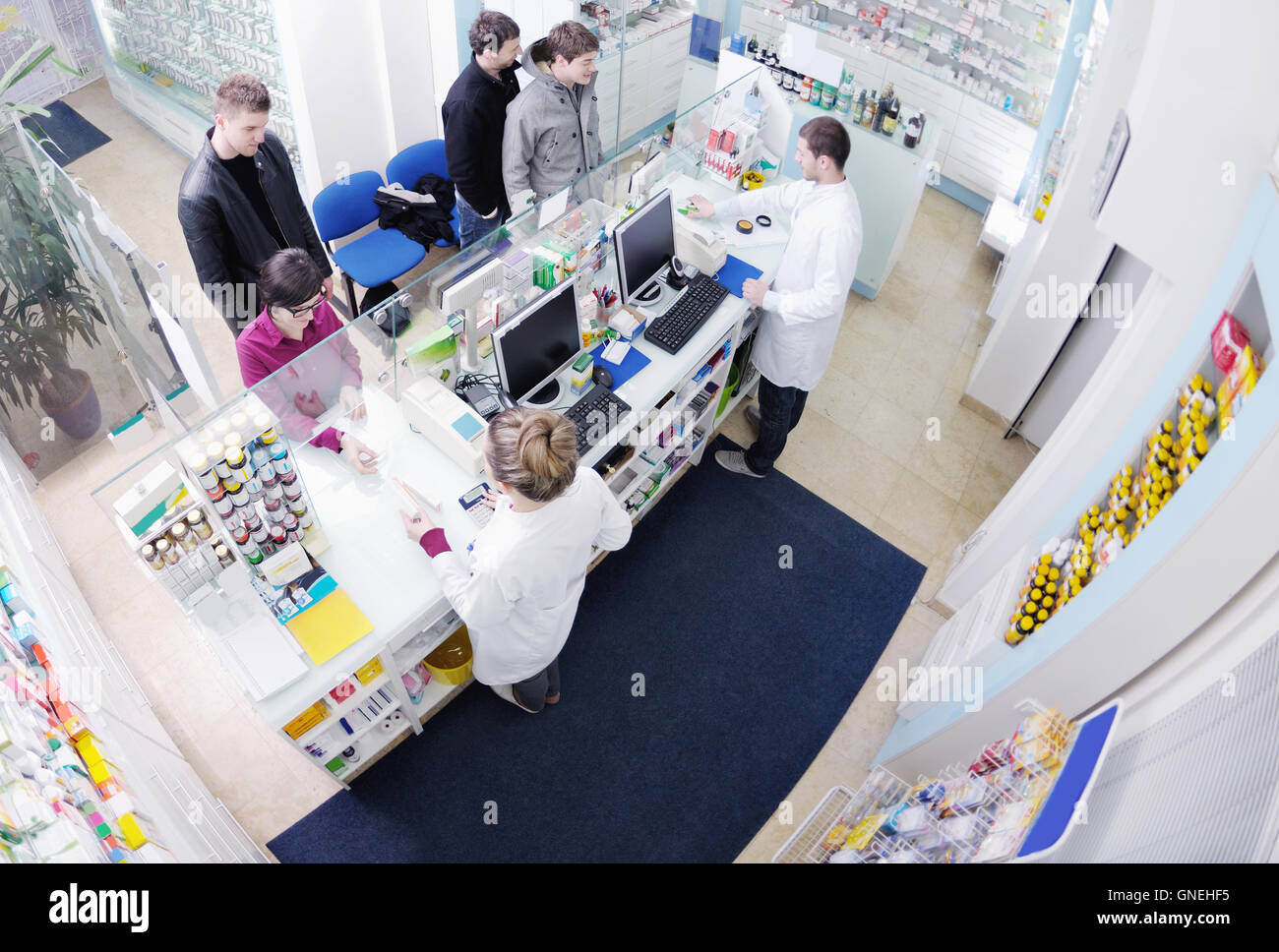 pharmacist suggesting medical drug to buyer in pharmacy drugstor Stock ...