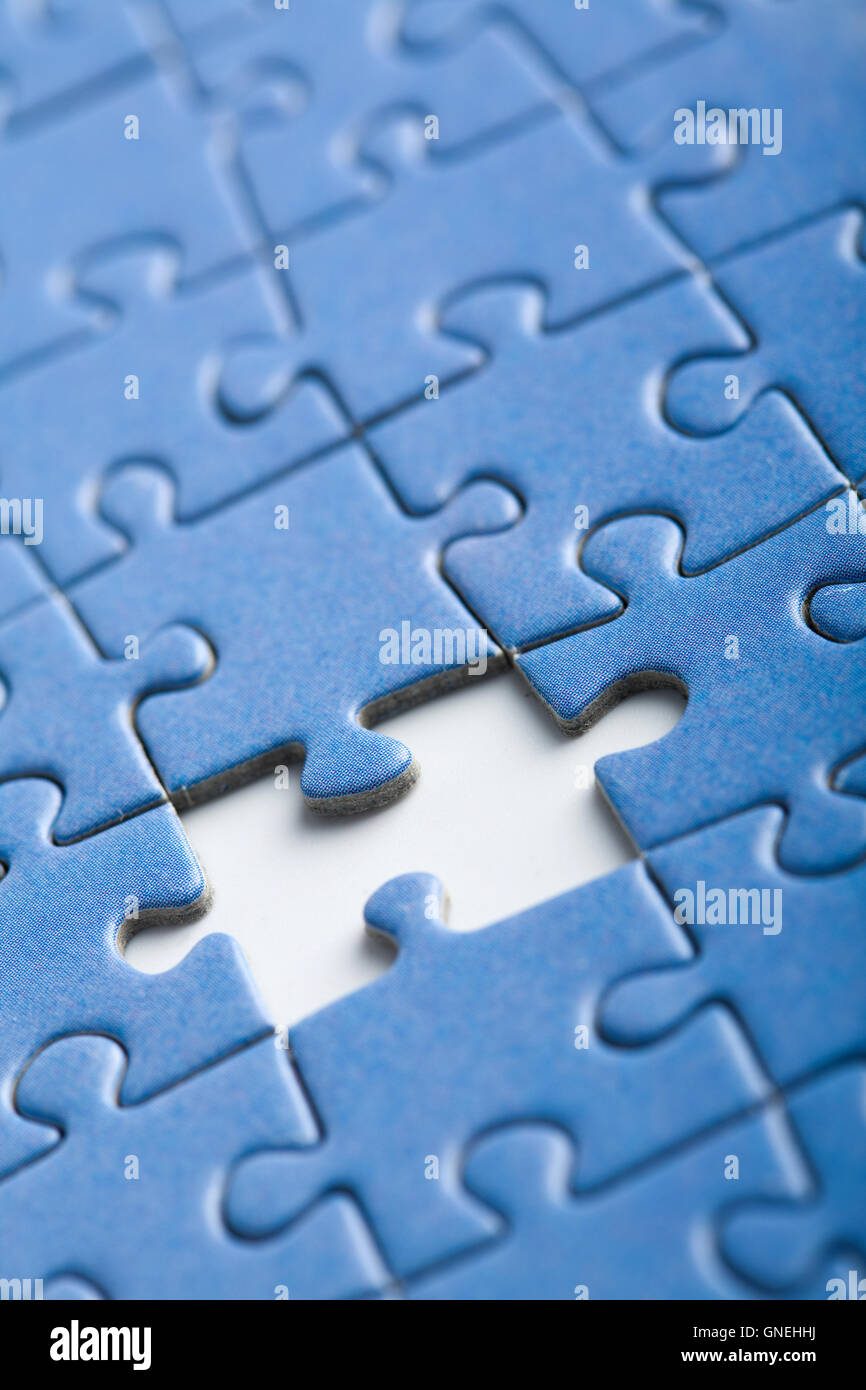 abstract puzzle background with one piece missing Stock Photo - Alamy
