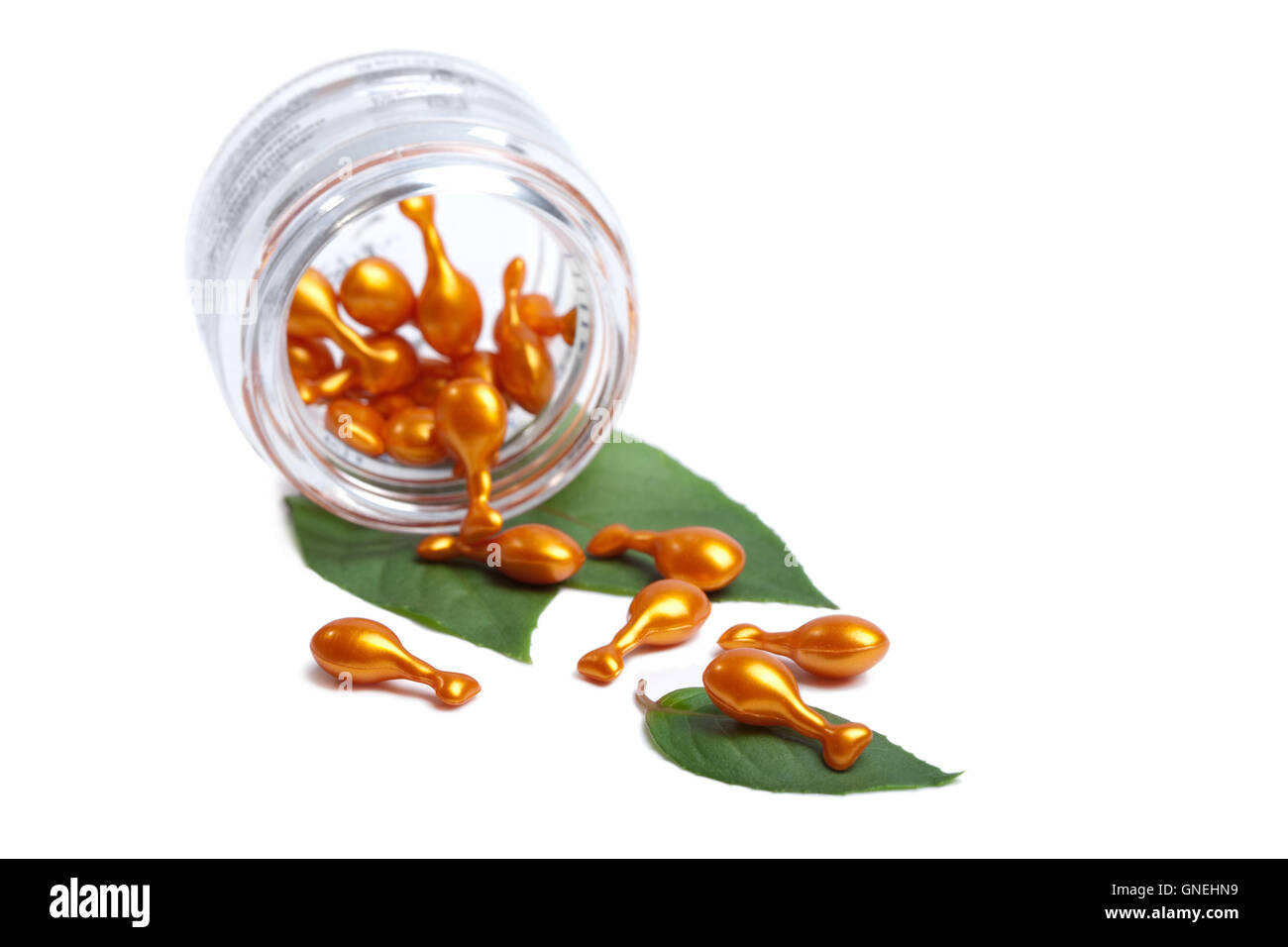 cosmetic capsules in glass bottle isolated Stock Photo - Alamy