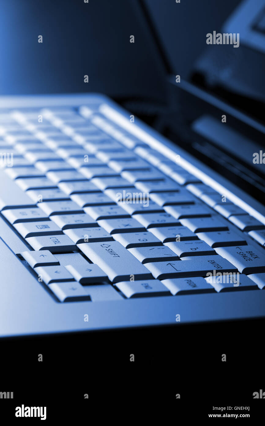 modern notebook keyboard over black background Stock Photo - Alamy