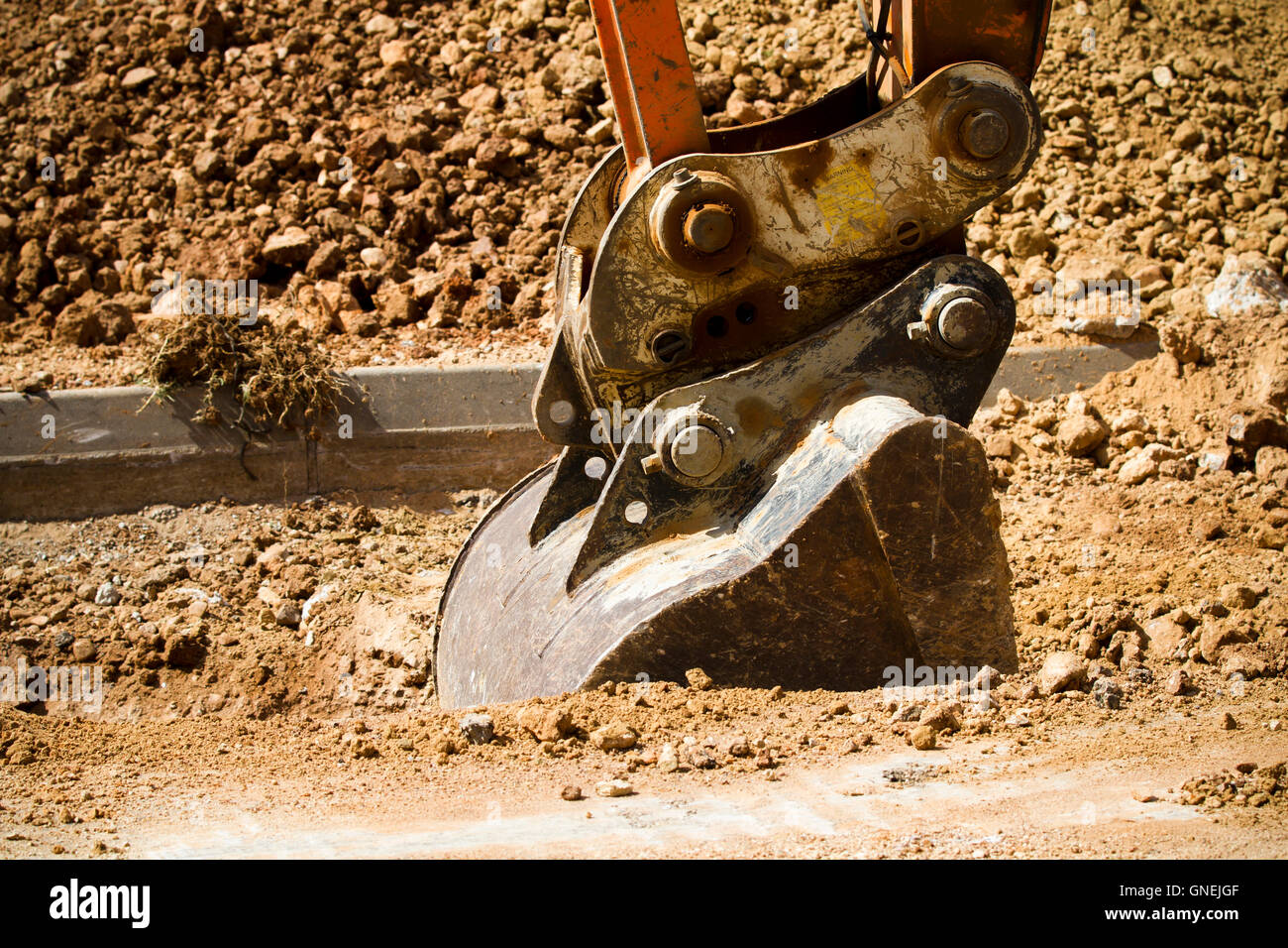Excavator digging a deep trench Stock Photo - Alamy
