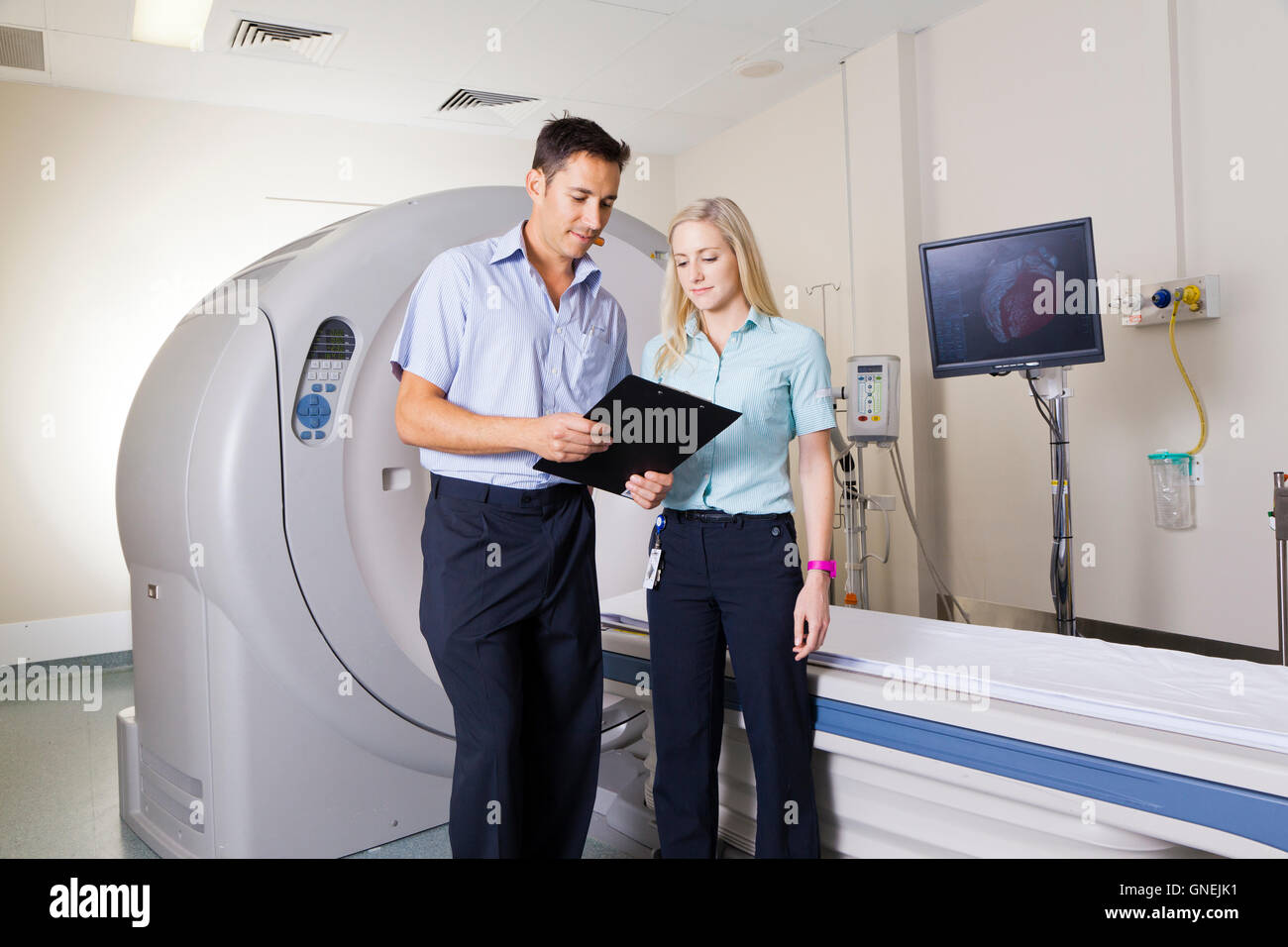 Doctor and nurse with MRI scanner Stock Photo - Alamy