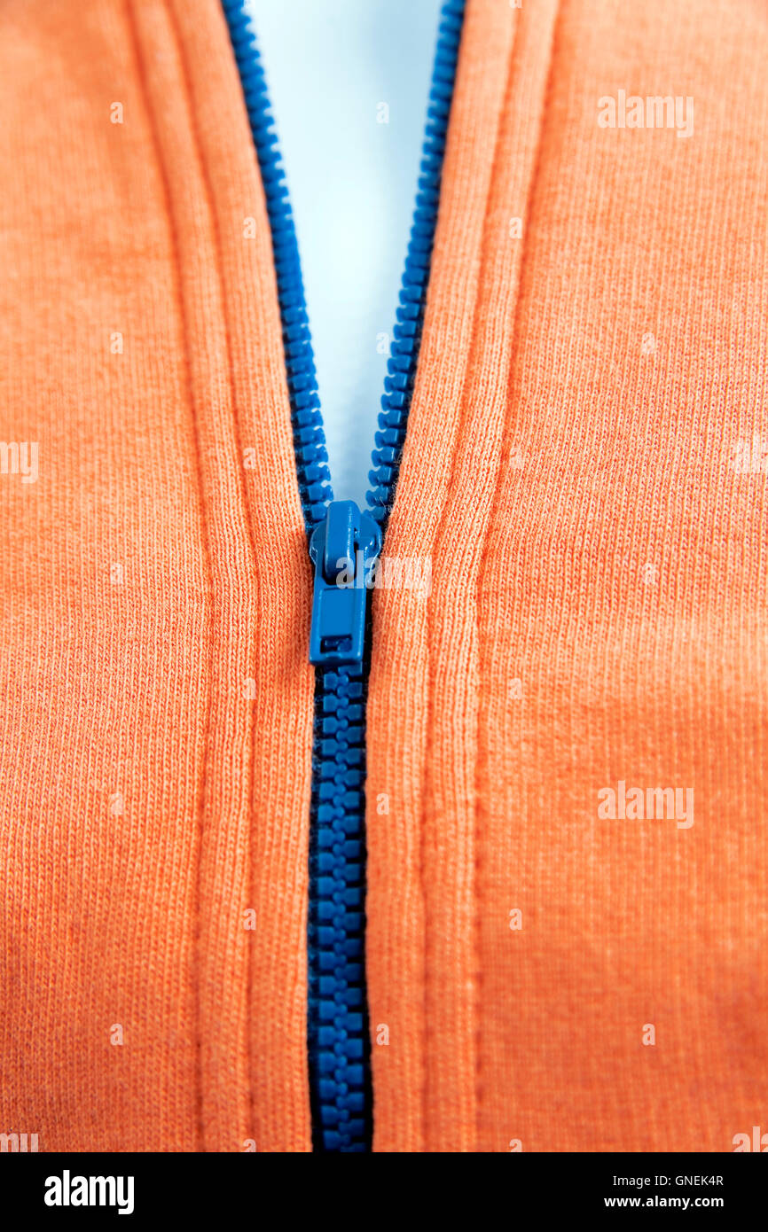 blue zipper on fashionable orange warm wear Stock Photo - Alamy