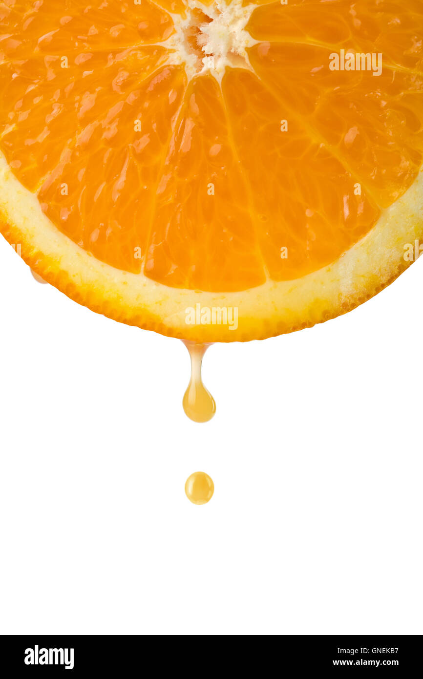 drop of juice falling from orange half isolated Stock Photo - Alamy