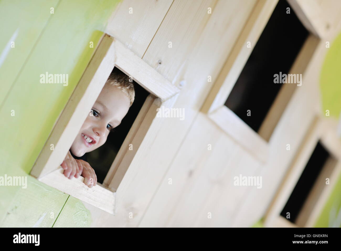 happy child in a window Stock Photo - Alamy