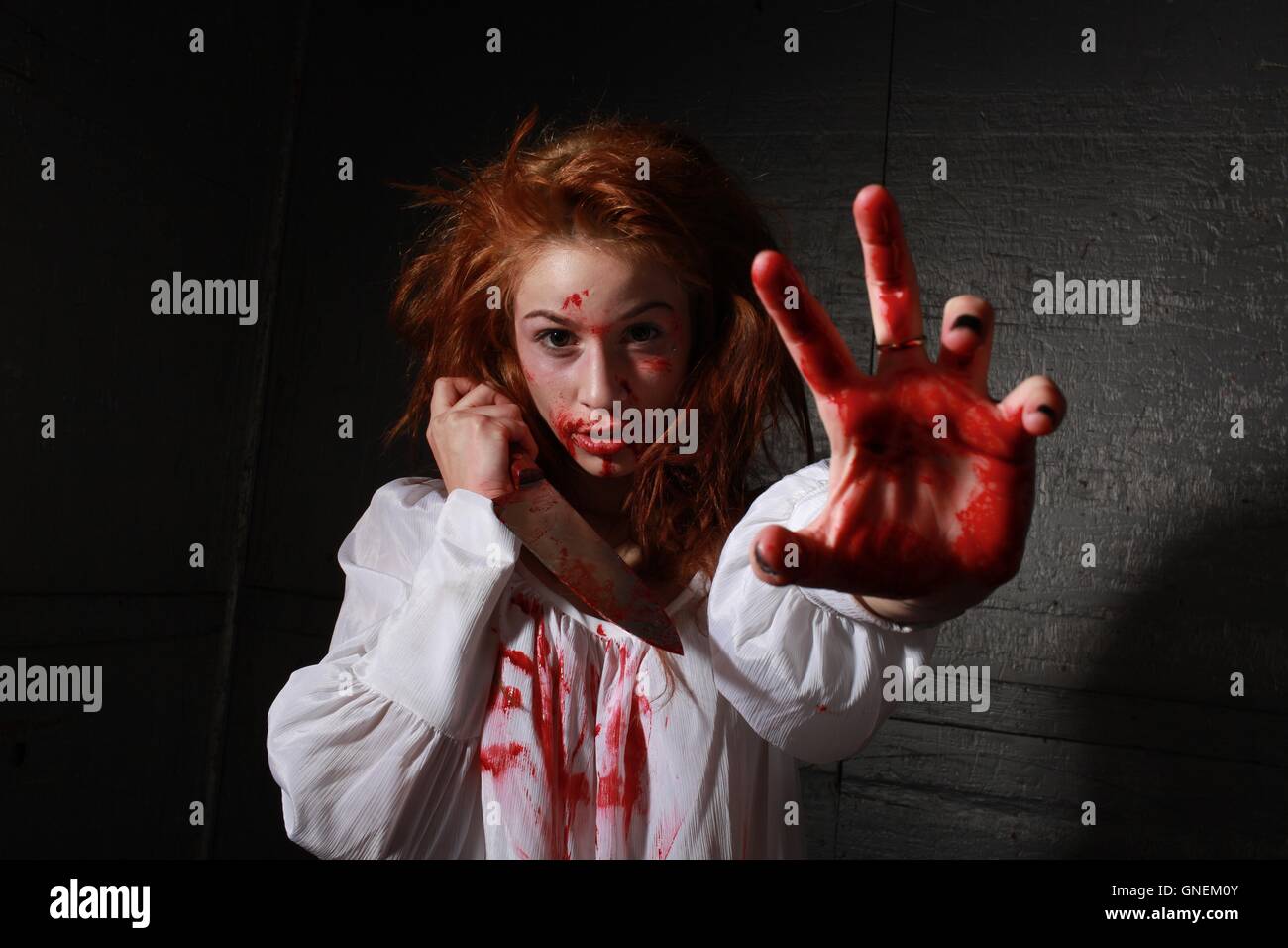Horror Themed Image With Bleeding Freightened Woman Stock Photo - Alamy