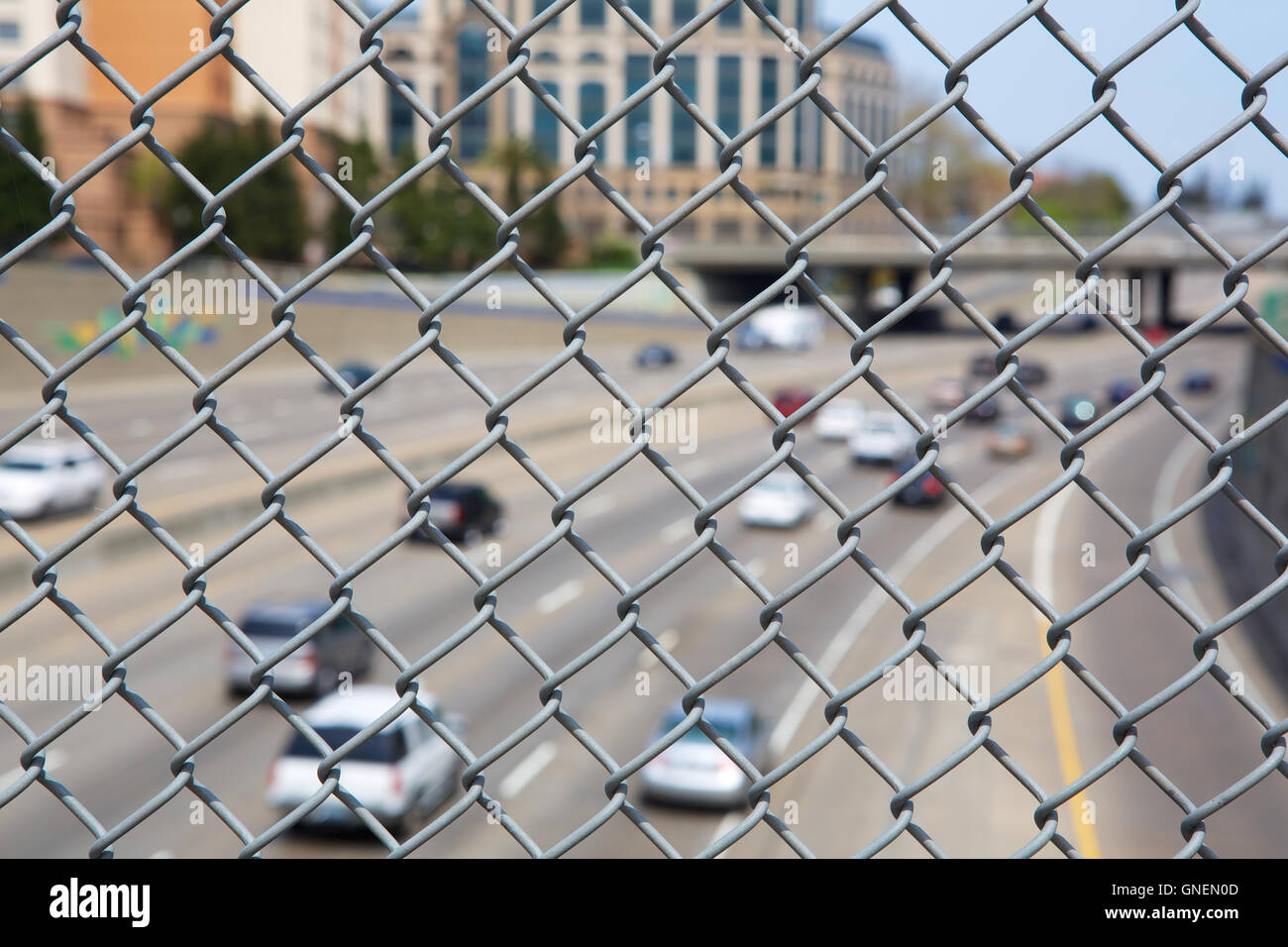 Highway Chain link fence up close Stock Photo - Alamy