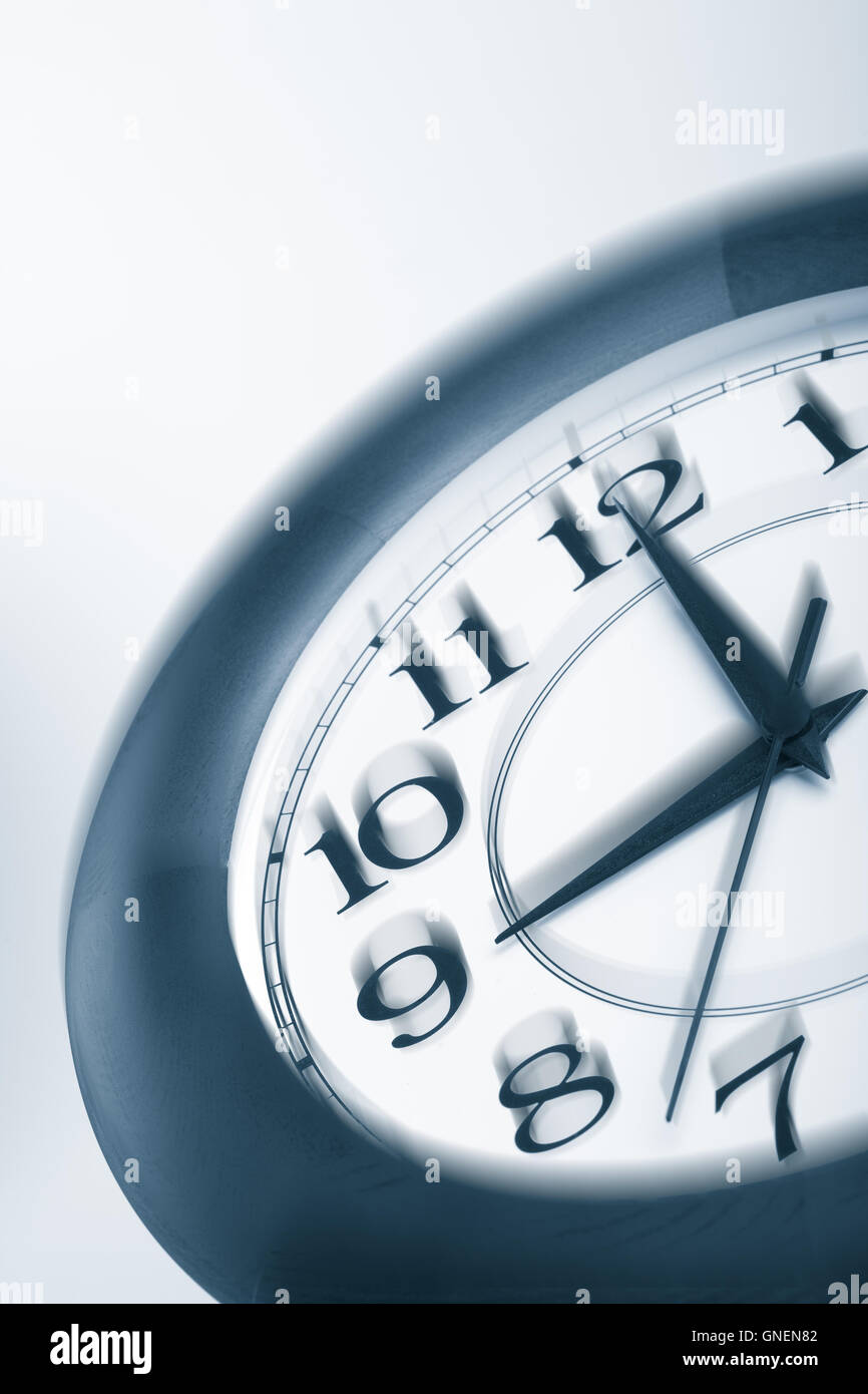 blue clock shaking. time consept Stock Photo - Alamy