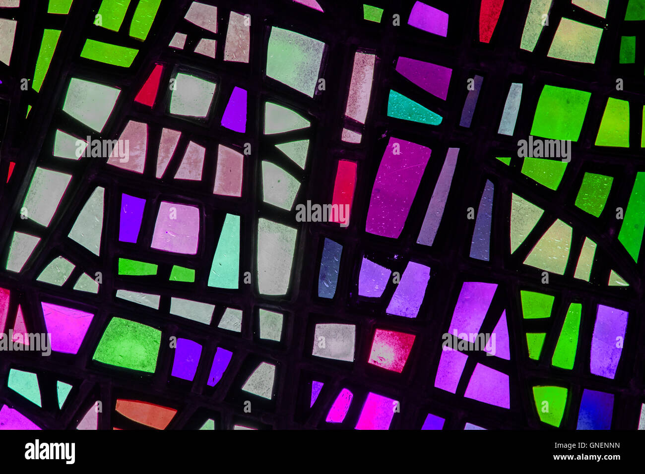 Image of a multicolored stained glass window with irregular block ...