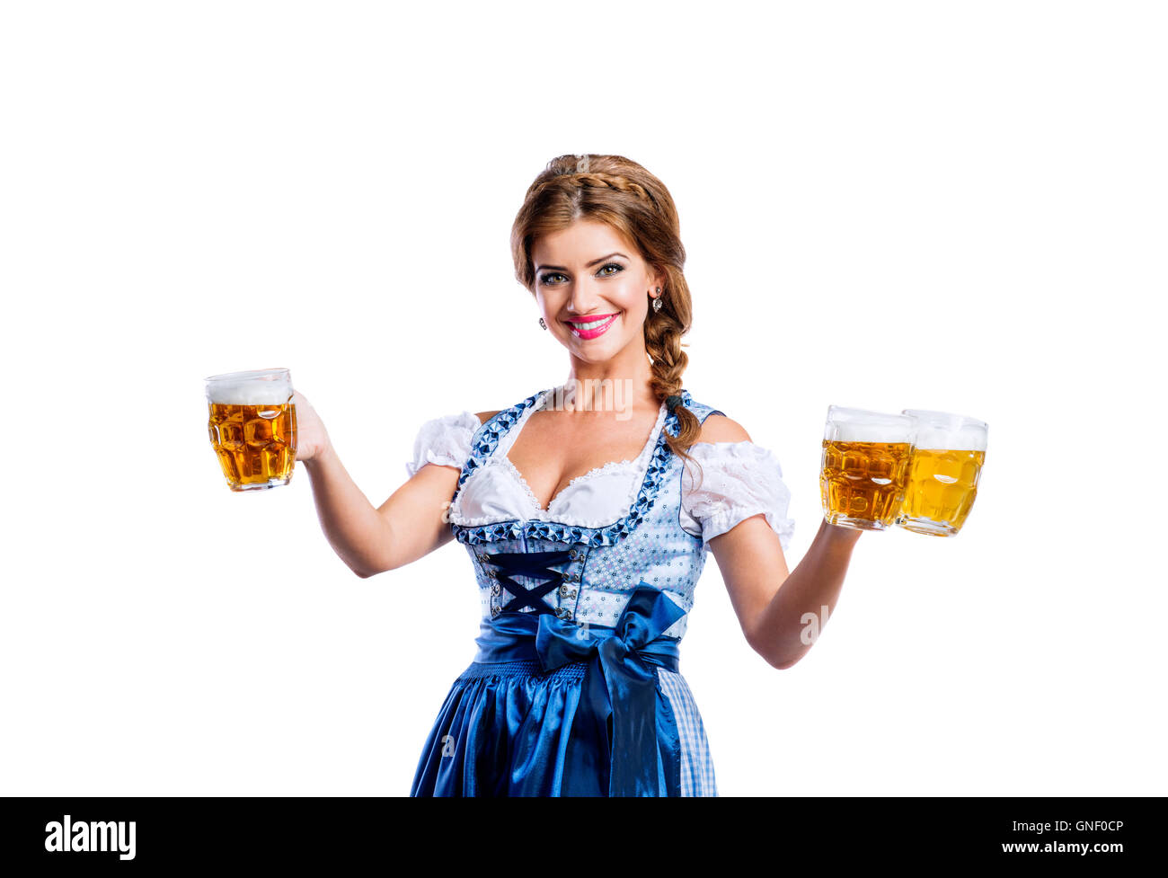 Woman young dirndl beer mugs hi-res stock photography and images - Alamy