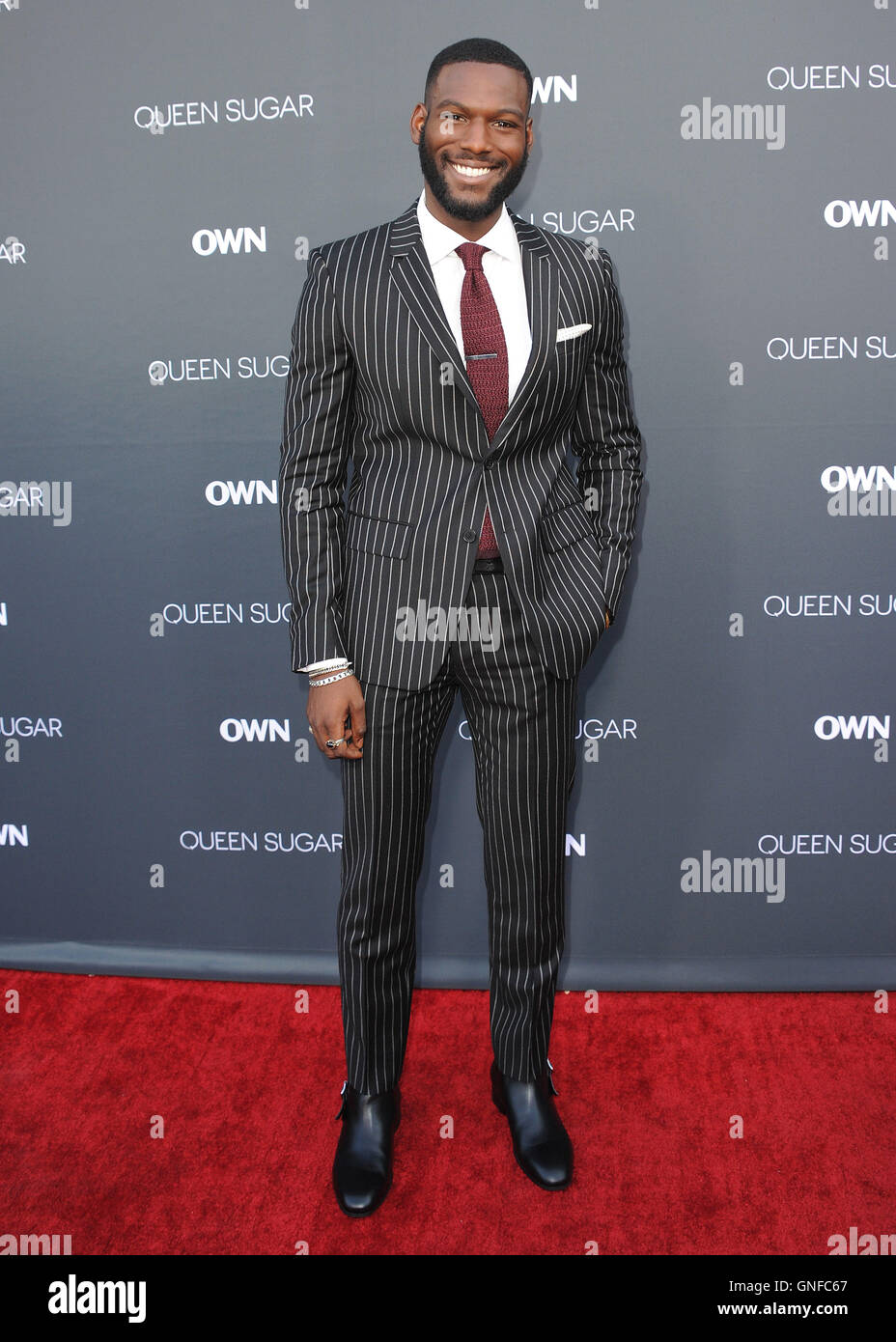 BURBANK, CA - AUGUST 29: Kofi Siriboe at the premiere of OWN's "Queen ...